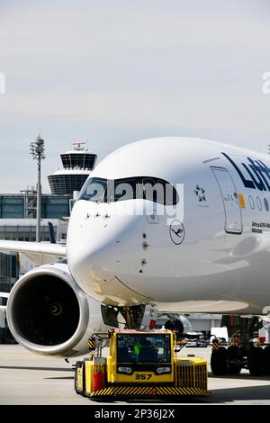 Lufthansa Airbus A350-900 towing with push-back truck in front of ...