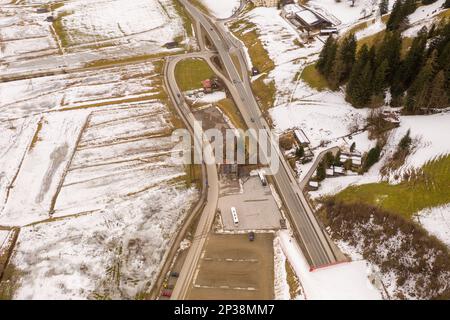 Drone photography of road tunnel exit from mountain and cars driving ...