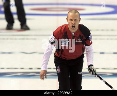 Team Canada skip Pat Simmons, left, and second Carter Rycroft discuss a ...