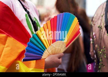 Colorful rainbow fan during gay pride, LGBT collective fan ...