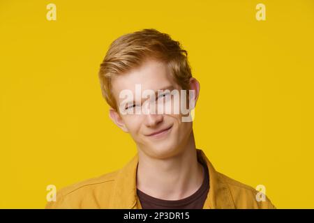 Emotion of Cunning and Deception Concept. A European Young Man shows an ...
