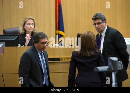 Defense attorneys Kirk Nurmi, right, and Jennifer Willmott listen to ...