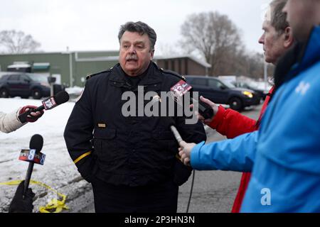Wyoming police Chief James Carmody, middle, holds a press conference ...