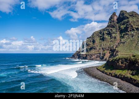 The rugged coastline of Punta del Hidalgo. with the Anaga Mountains in ...