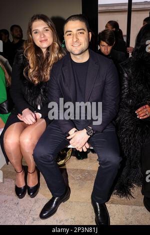 A guest and Michel Saab attend the Elie Saab show during Paris Fashion Week Womenswear Fall ...