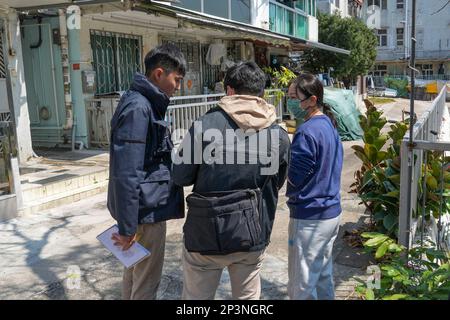 Police officers conduct questionnaire with residents in Lung Mei ...
