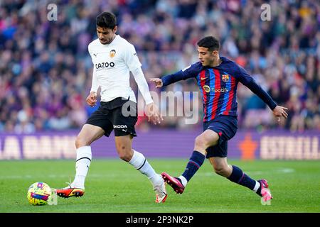 Eray Comert of Valencia CF and Alarcon of FC Barcelona during the La Liga match between FC ...