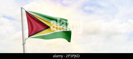 Guyana flag waving on sky background. 3D Rendering Stock Photo - Alamy