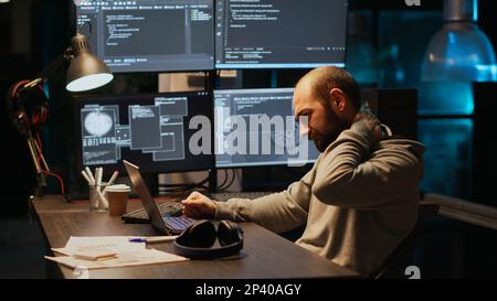 Frustrated tired developer programming server database, feeling stressed about artificial ...