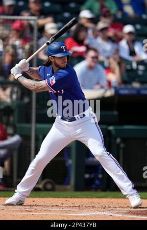 Texas Rangers' Jonah Heim bats during the fifth inning of a spring ...