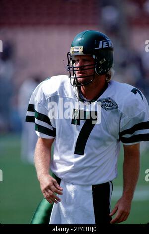 Quarterback Boomer Esiason #7 of the New York Jets is dejected after ...