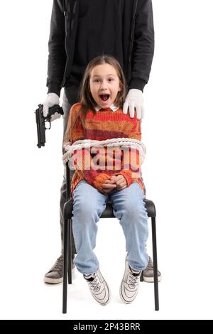 Terrorist with gun and scared little hostage on white background Stock ...