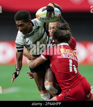 Fiji's Reapi Ulunisau, front left, is tackled by Canada's Breanne ...