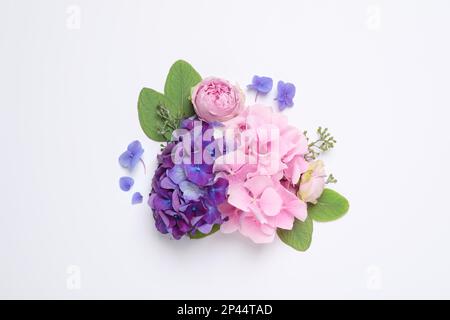 Flat lay composition with beautiful hortensia flowers on light blue ...