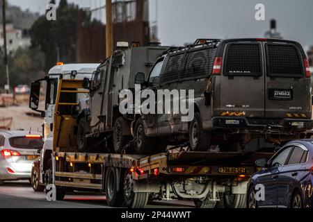 Israeli army vehicles are seen during a military operation in the West ...