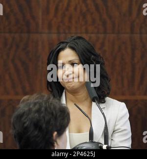 Dr. Ana Maria Gonzalez-Angulo sits in court with defense attorney Andy ...