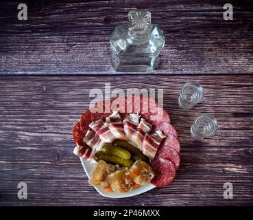 Fresh smoked russian sausage cut in slices on wooden surface Stock ...