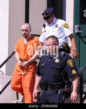 Elyette Barbour, left, is escorted from the Northumberland County ...