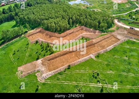 Removal of the top layer of earth overburden for the development of a ...