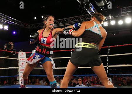 Noemi "NoNo" Bosques (red) and Yolaine LinDeLauf fight during a ...
