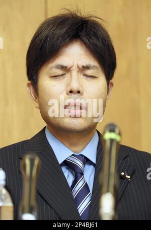 Hyogo Prefectural Assenbly member Ryutaro Nonomura listens to a ...