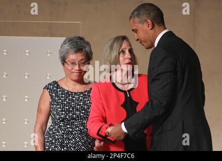 President Barack Obama greets Ling Young and Alison Crowther during the ...