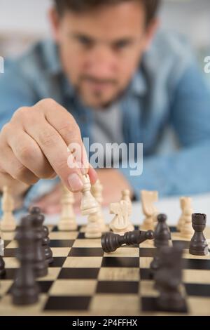 businessman playing chess game figures on wooden table for analysis new ...