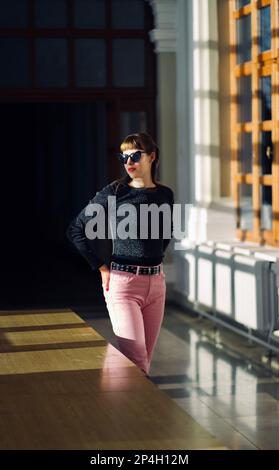 Women in Tall Hallway with Shadows Stock Photo - Alamy