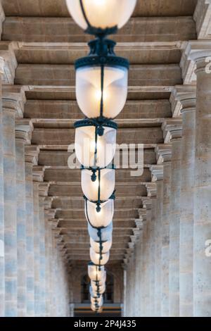 Portrait photo of The Arcade Ceiling and Lamps in The Palais Royale in ...