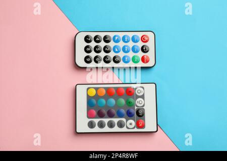 Different remote controls on color background, flat lay Stock Photo - Alamy