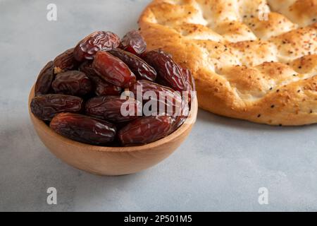 Traditional Ramadan pita on bright blue background.Holy bread for ...