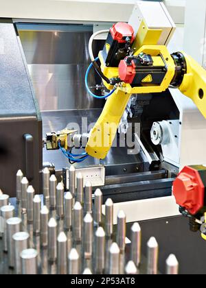 Robotic arm and cnc lathe machine Stock Photo - Alamy