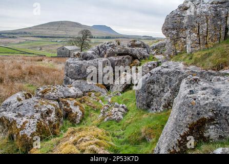 Limestone outcrop below Whernside looking across toward Ingleborough ...