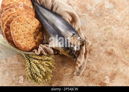 Catholic still life of five loaves of bread and two fish Stock Photo ...