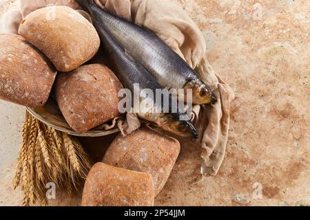 Catholic still life of five loaves of bread and two fish Stock Photo ...