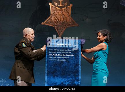 Regan Hopper, the daughter of retired Army Col. Paris Davis, one of the ...