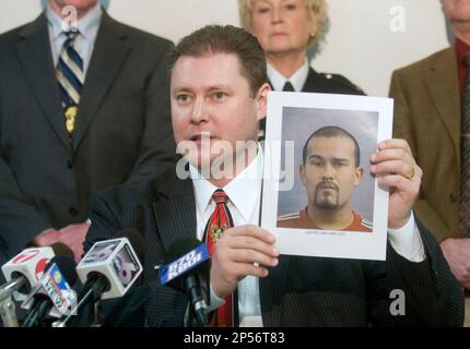 Canyon County Prosecutor John Bujak speaks to the media after the ...