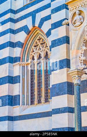 Carved marble facade of Doumo of Monza and large lace rose window ...
