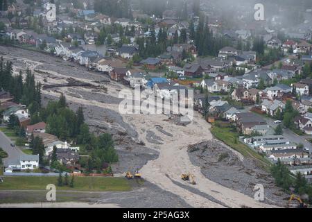 This aerial photo shows Cougar Creek running through Canmore, Alberta ...