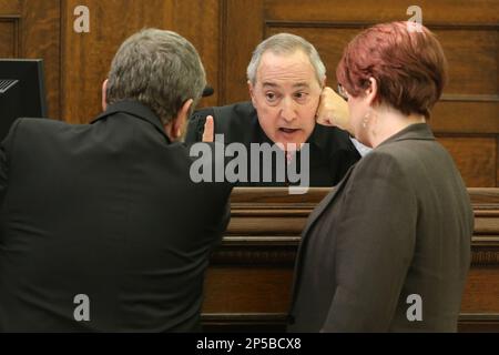 Brett Seacat, left, talks with his attorney John Val Wachtel during a ...