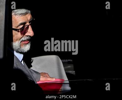 Speaker of the Iranian Parliament Gholam Ali Hadad Adel, right, waves ...
