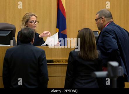 Defense attorneys Kirk Nurmi, right, and Jennifer Willmott listen to ...