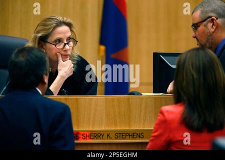 Defense attorneys Kirk Nurmi, right, and Jennifer Willmott listen to ...