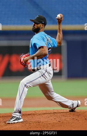 Miami Marlins pitcher Sandy Alcantara smiles as he walks to the dugout ...