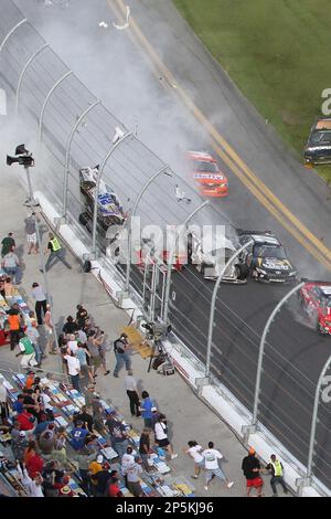 A horrific wreck of NASCAR driver Kyle Larson occurs with debris flying ...