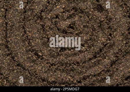 Spiral poured ground black pepper background. Dry seasoning pepper ...
