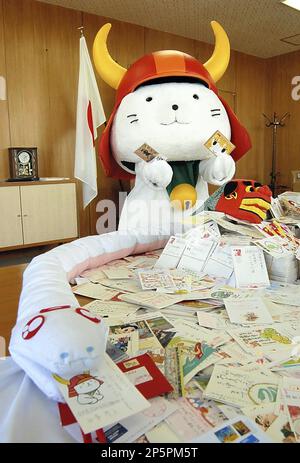 Hikonyan, a yuruchara mascot of Hikone city, Shiga Prefecture, is happy ...