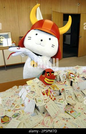 Hikonyan, a yuruchara mascot of Hikone city, Shiga Prefecture, is happy ...