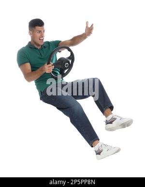 Man on stool with steering wheel against white background Stock Photo ...