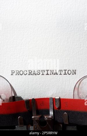 Procrastination word written with a typewriter Stock Photo - Alamy